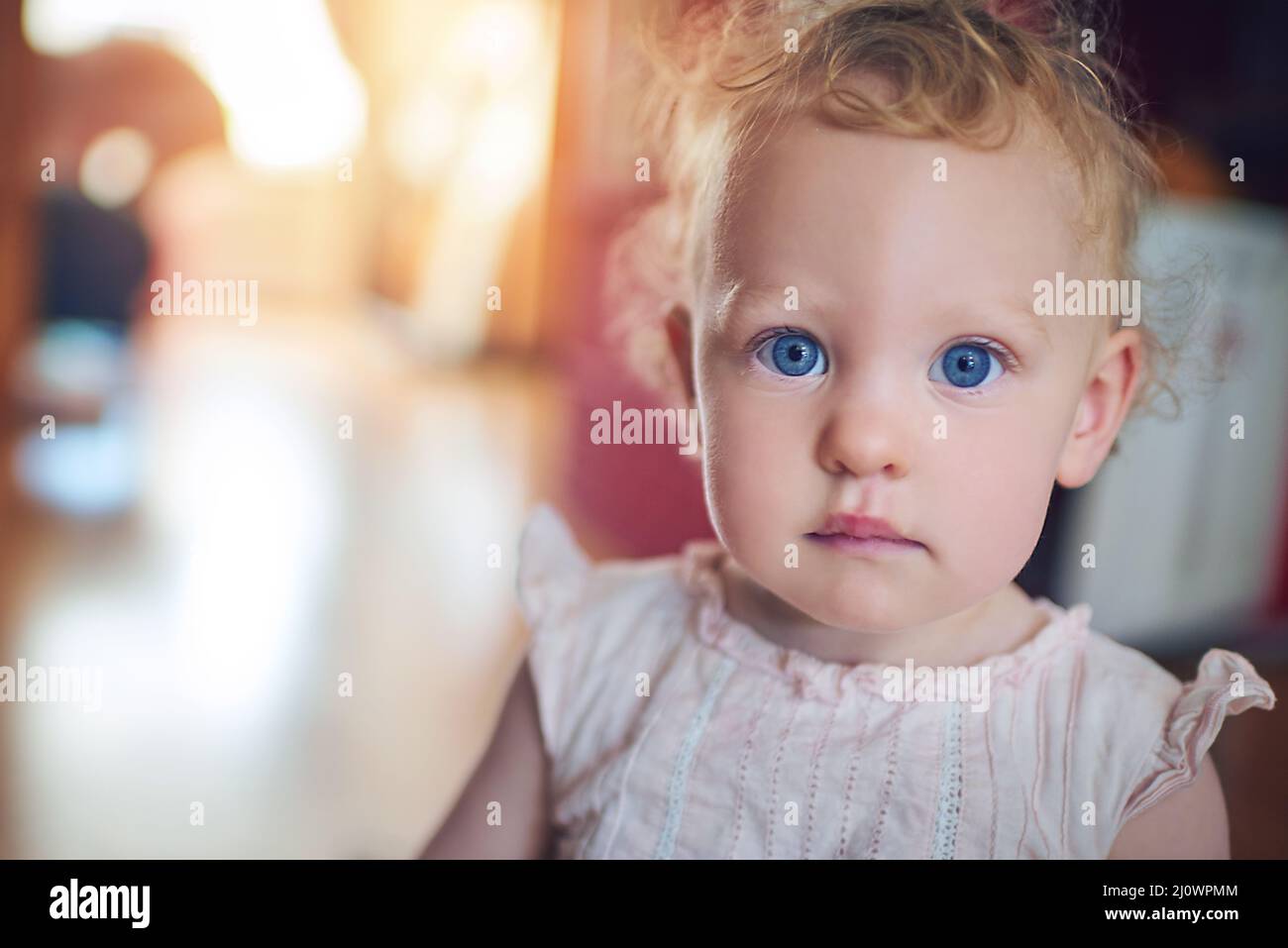Cute just got way cuter. Portrait of an adorable little girl at home Stock Photo - Alamy
