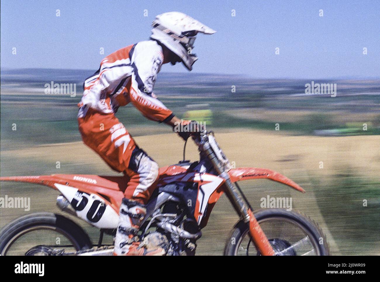 Motocross red motorbike Honda CFR in the mud track Stock Photo - Alamy