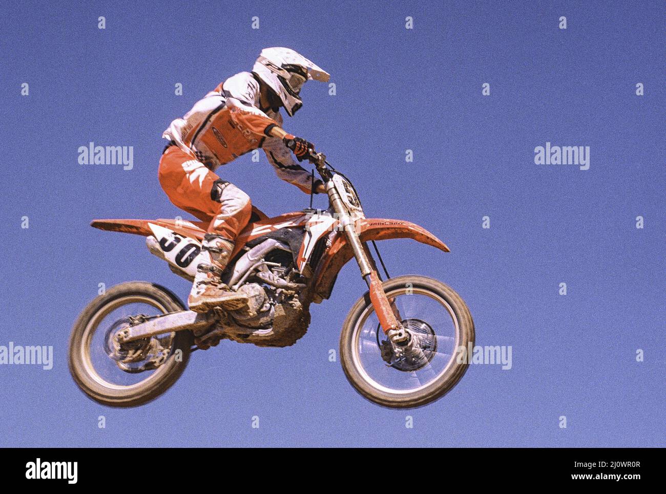 Motocross red motorbike Honda CFR in the mud track Stock Photo - Alamy
