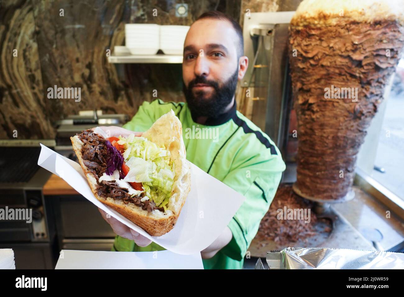 Berlin, Germany. 19th Mar, 2022. Galip from Imren Grill prepares a ...