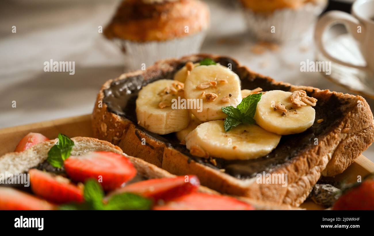 Close-up, Yummy whole grain toast with slide banana and dark chocolate ...