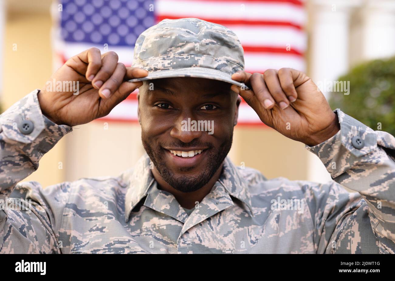 Portrait of smiling male african american army soldier wearing cap and ...