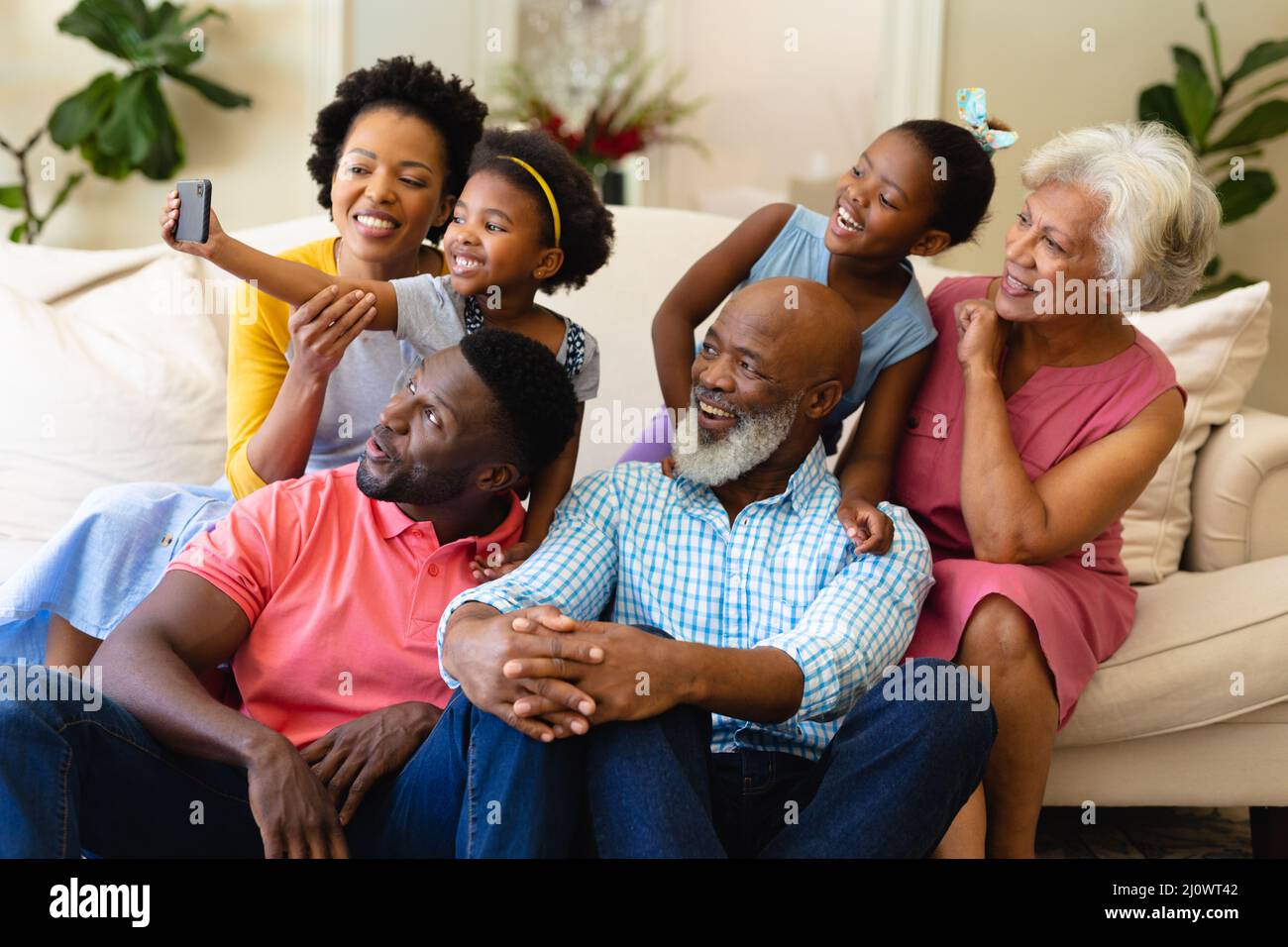 African american three generation family taking a selfie sitting ...