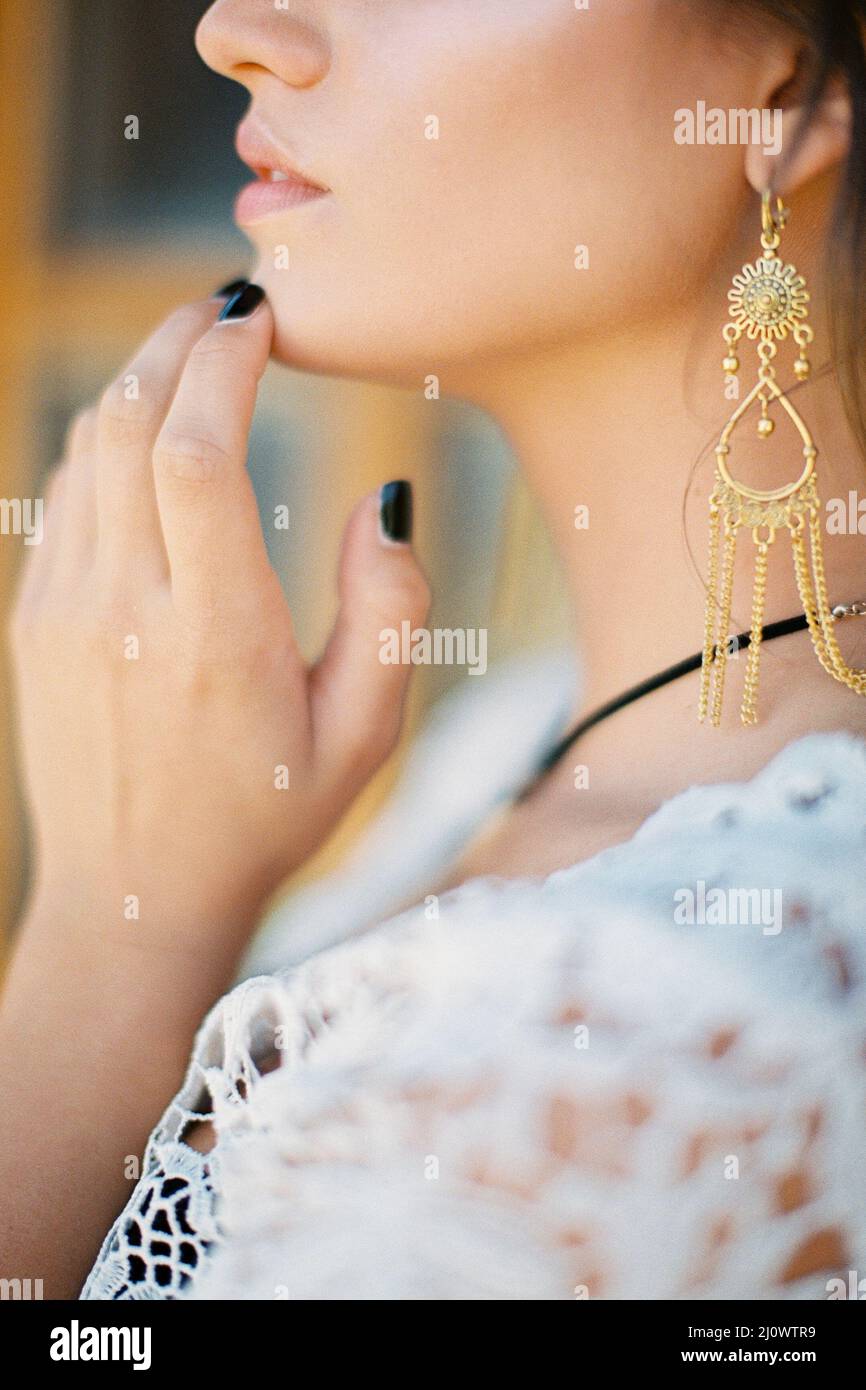 Woman touch chin hi-res stock photography and images - Alamy