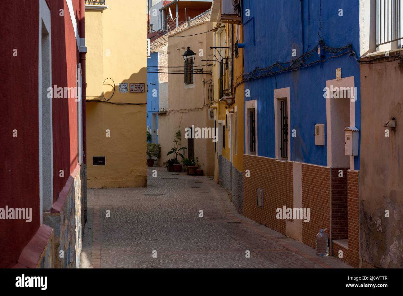 Narrow street with many colorful houses in the center of the historic ...