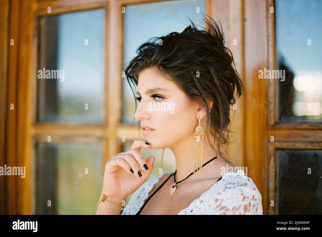 Woman touch chin hi-res stock photography and images - Alamy