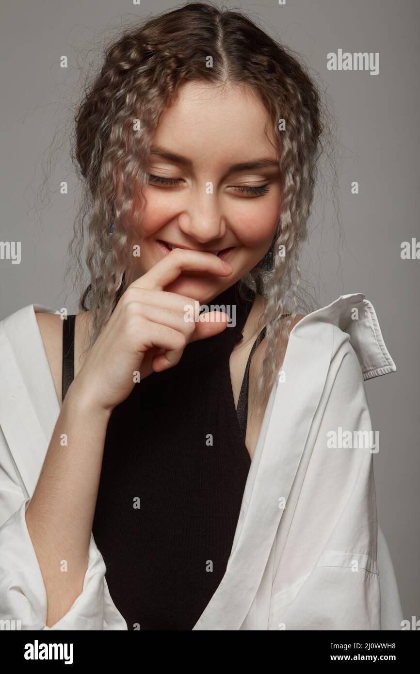 Shy girl hiding hi-res stock photography and images - Alamy