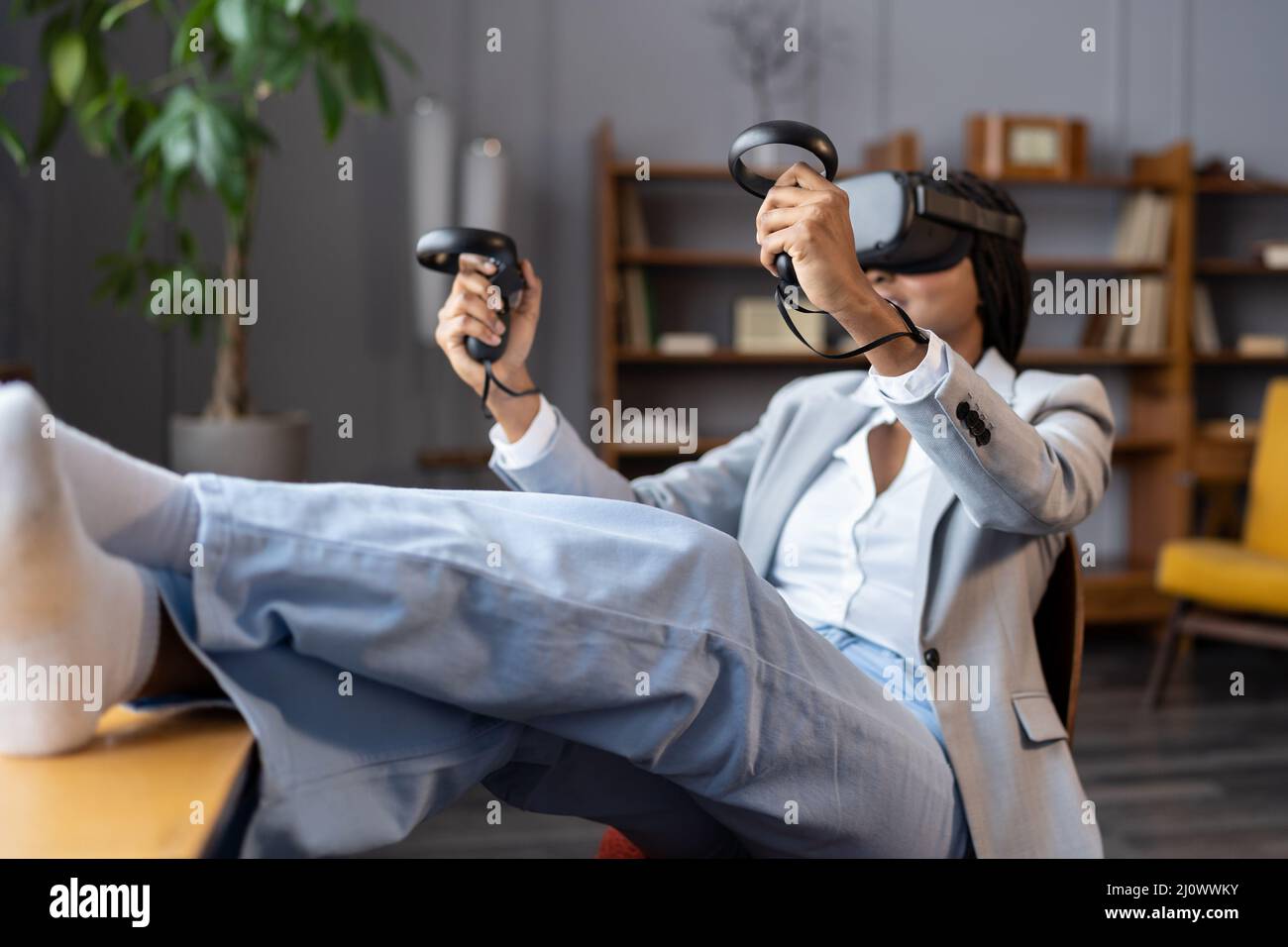 VR goggles for entertainment. Woman wear virtual reality glasses use ...