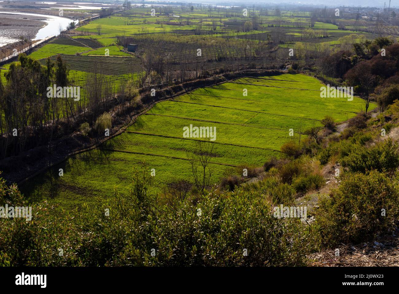 Beautiful scenery of lush green fields high angle view from hill Stock ...
