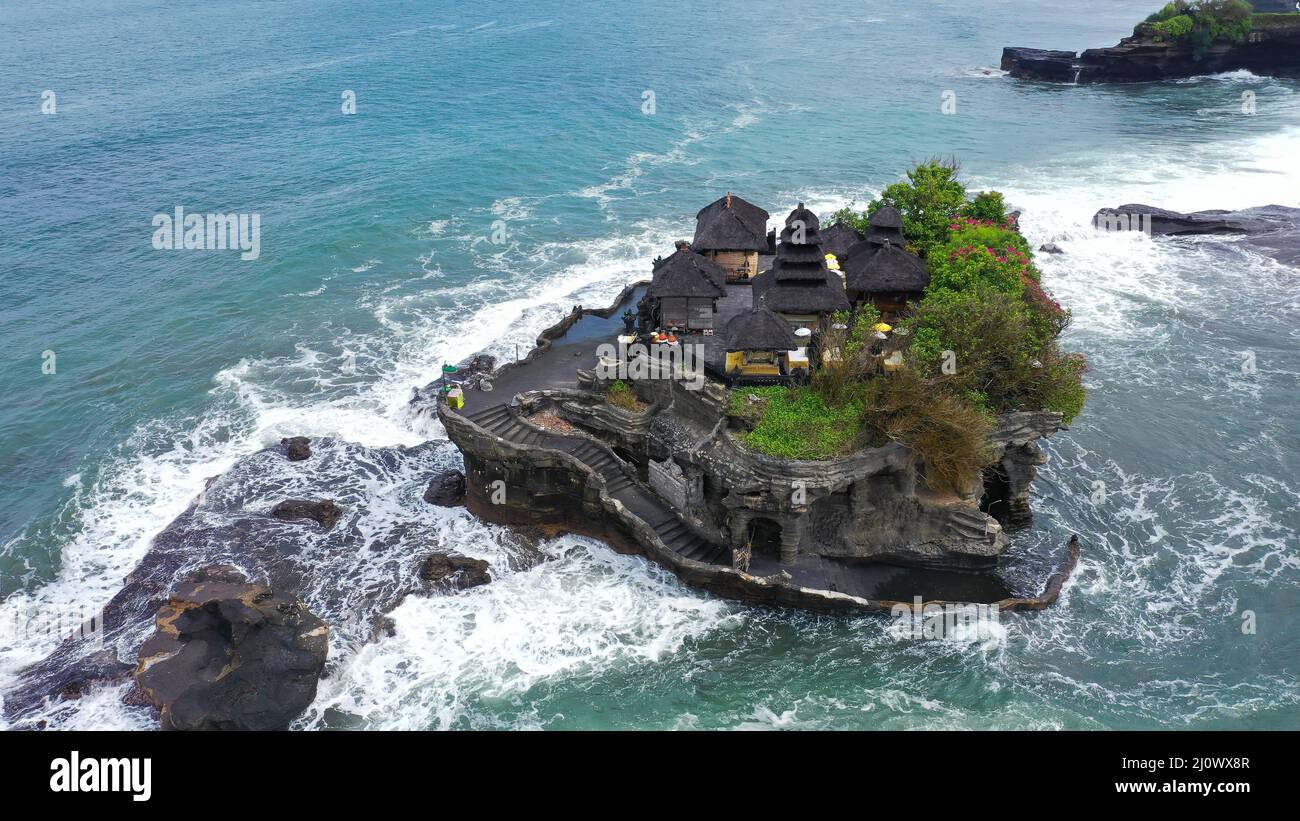 Breathtaking aerial view of of Tanah Lot Temple. Tanah Lot is a rock ...