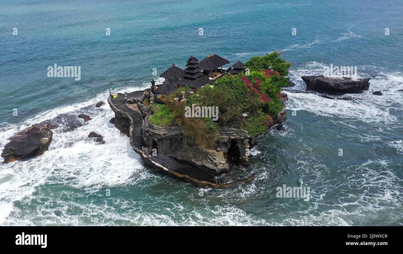 Breathtaking aerial view of of Tanah Lot Temple. Tanah Lot is a rock ...