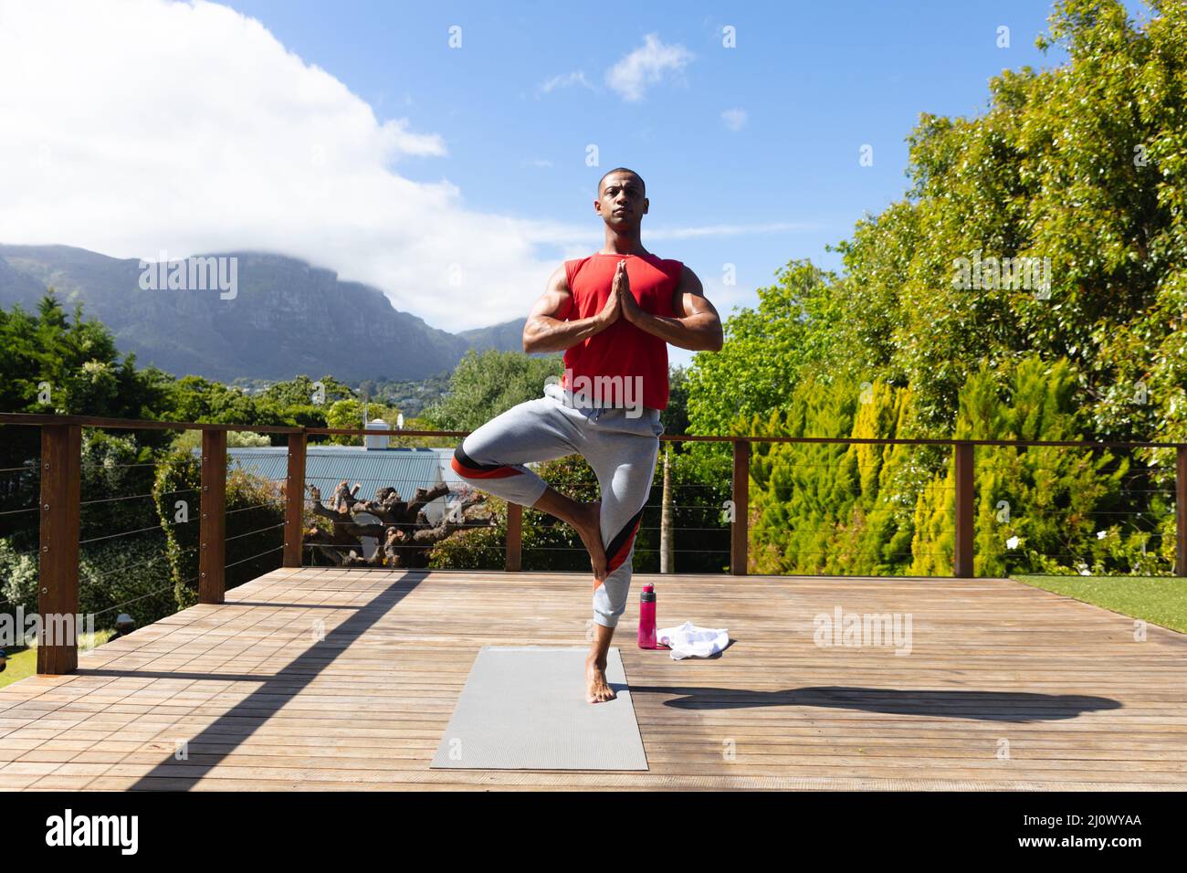 Young man stretching on terrace hi-res stock photography and images - Alamy