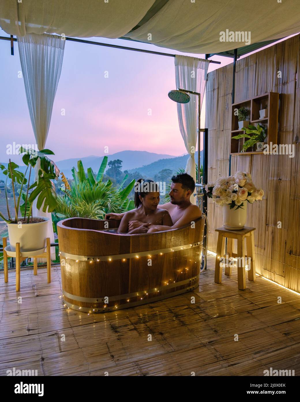 Bath tub during sunset in the mountains of Chiang Mai Thailand, elaxing ...