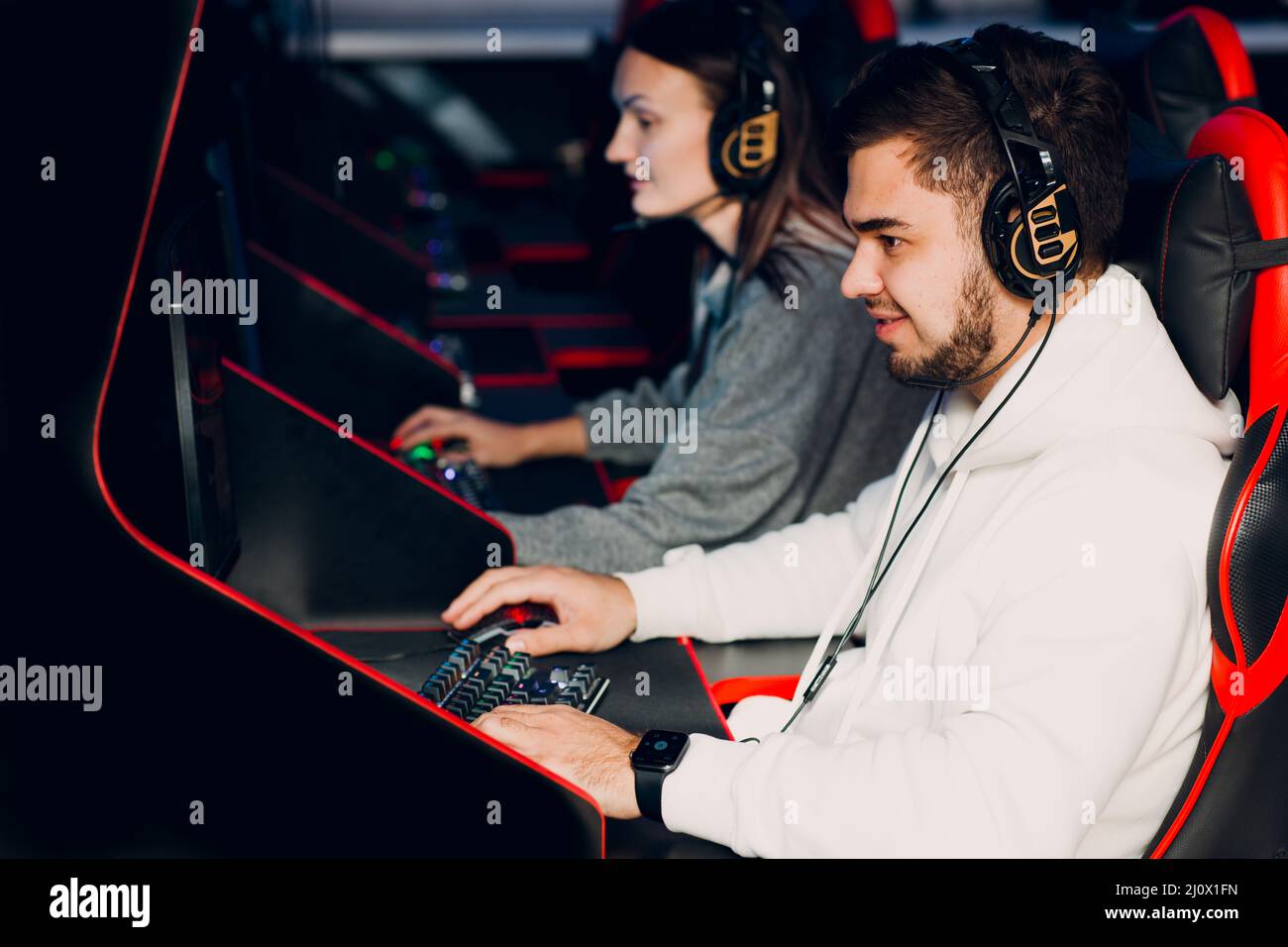 Guy playing gaming game on computer at game club Stock Photo - Alamy
