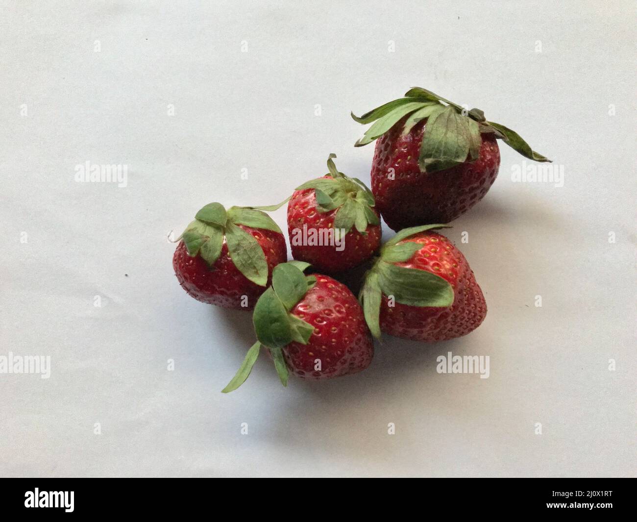 five strawberries isolated on white background . Strawberry isolated ...