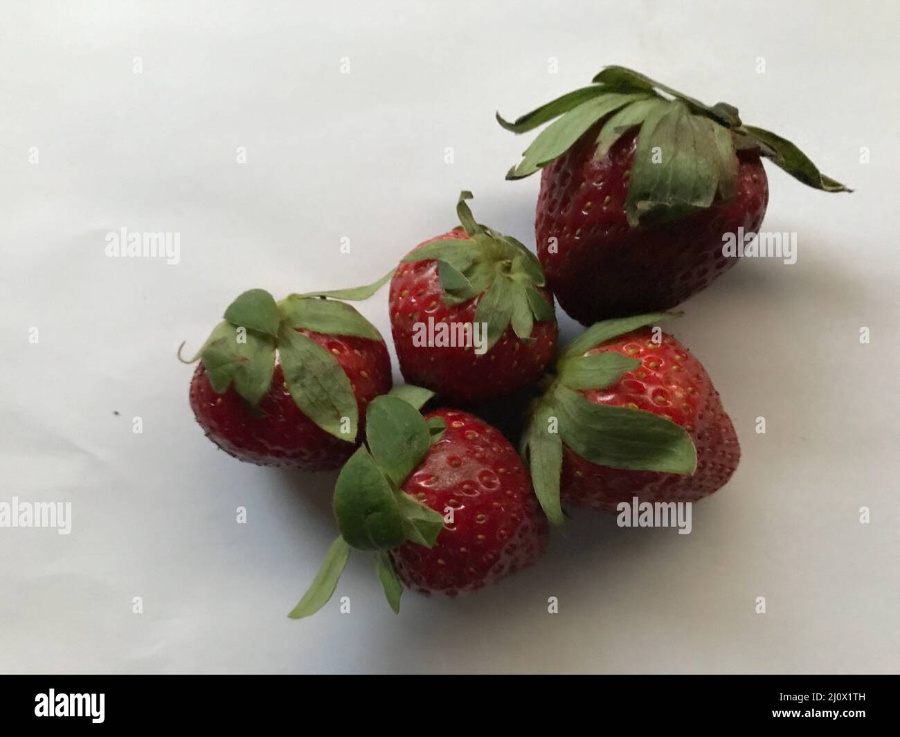 five strawberries isolated on white background . Strawberry isolated ...