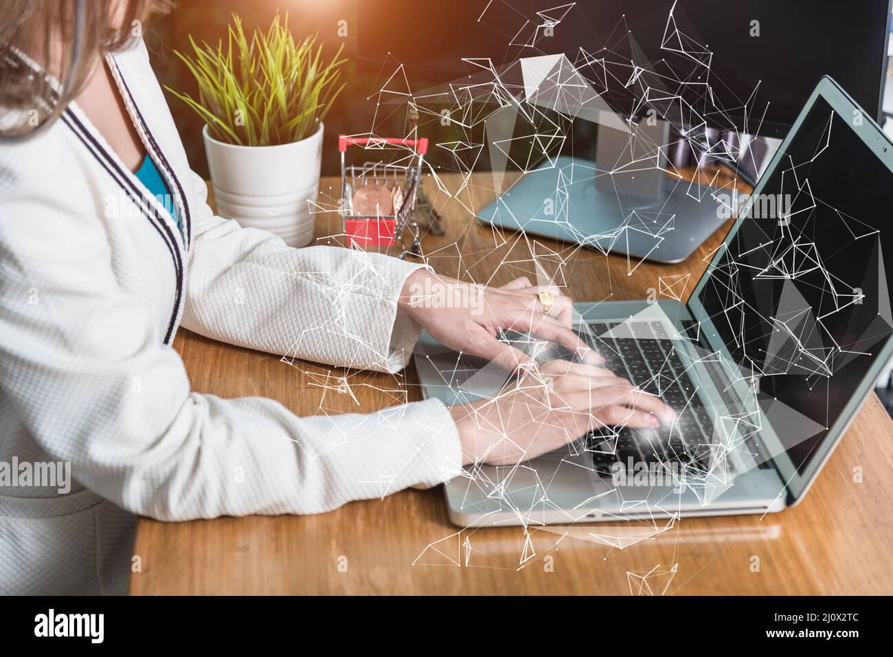 Business woman networking with laptop on holographic global social ...