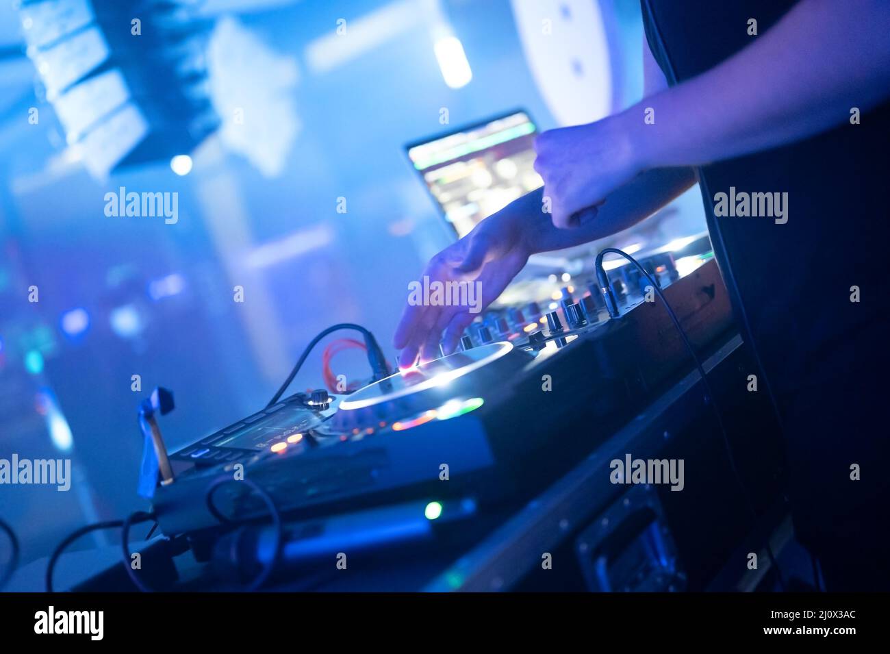 Dj mixing at party festival with light and smoke in background - Summer ...