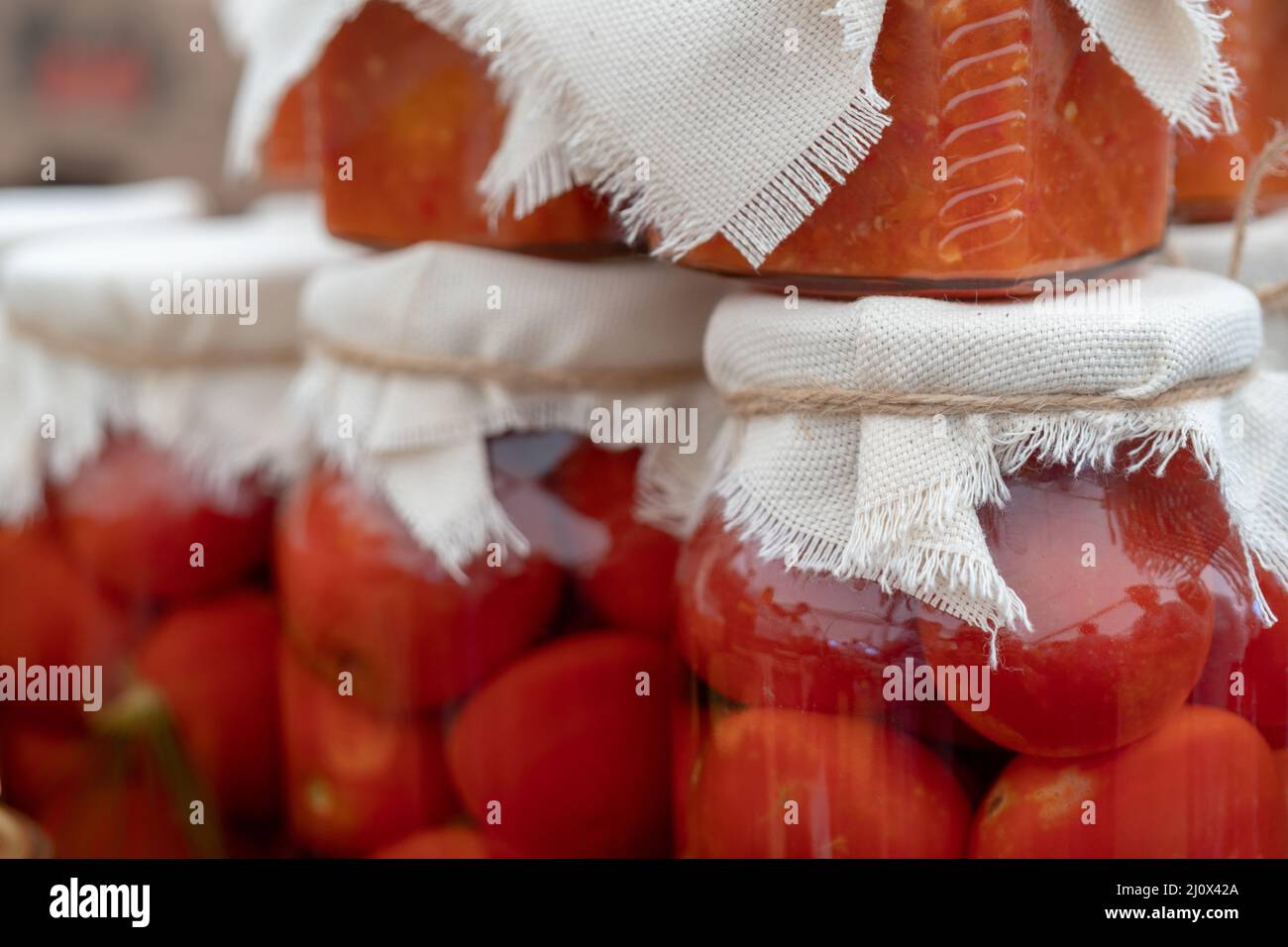 Canned tomatoes in glass jars Stock Photo - Alamy