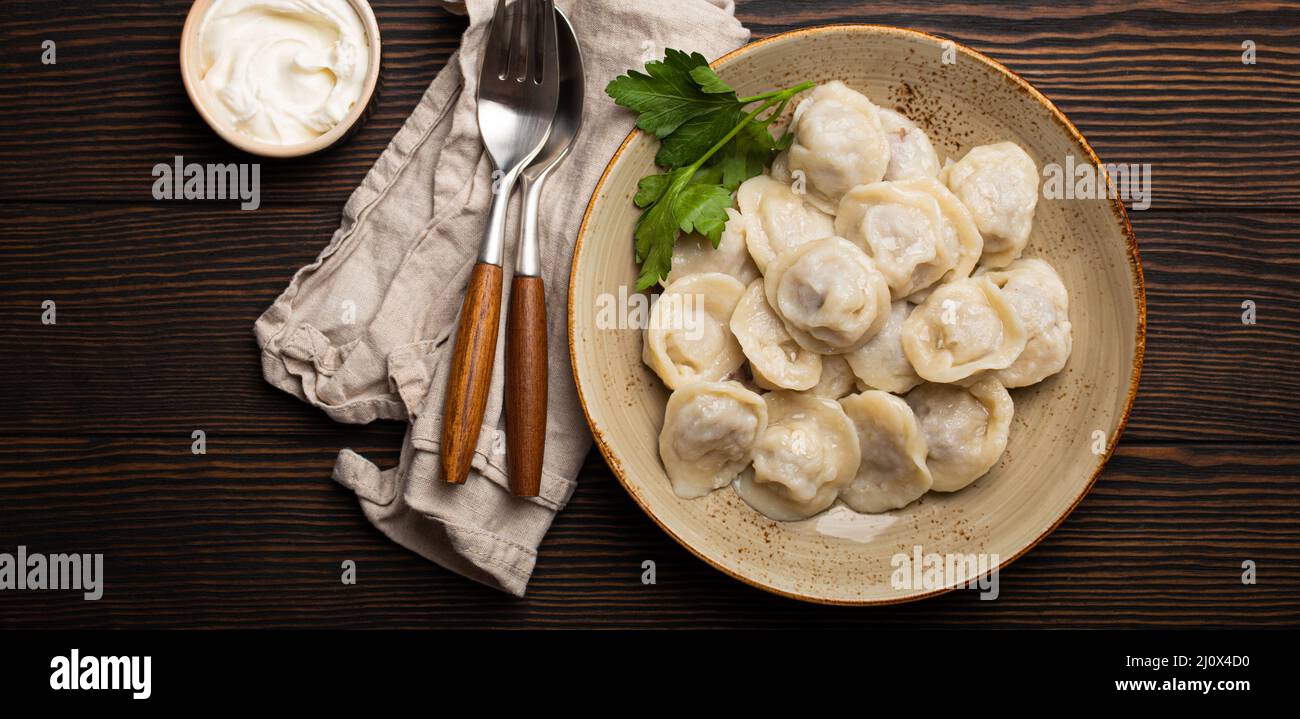 Pelmeni, traditional dish of Russian cuisine, boiled dumplings with ...