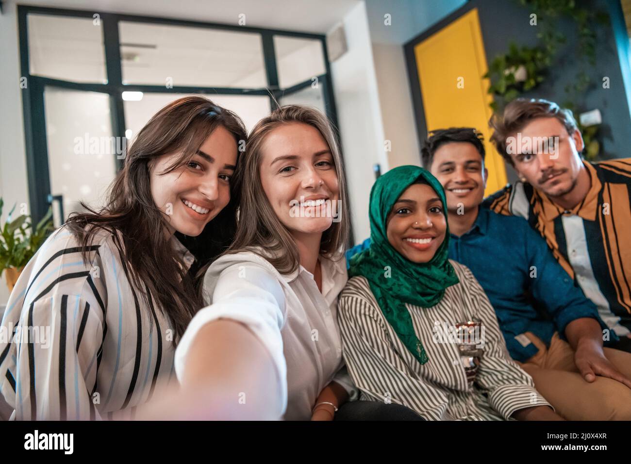 Group of business people during break from the work taking selfie ...