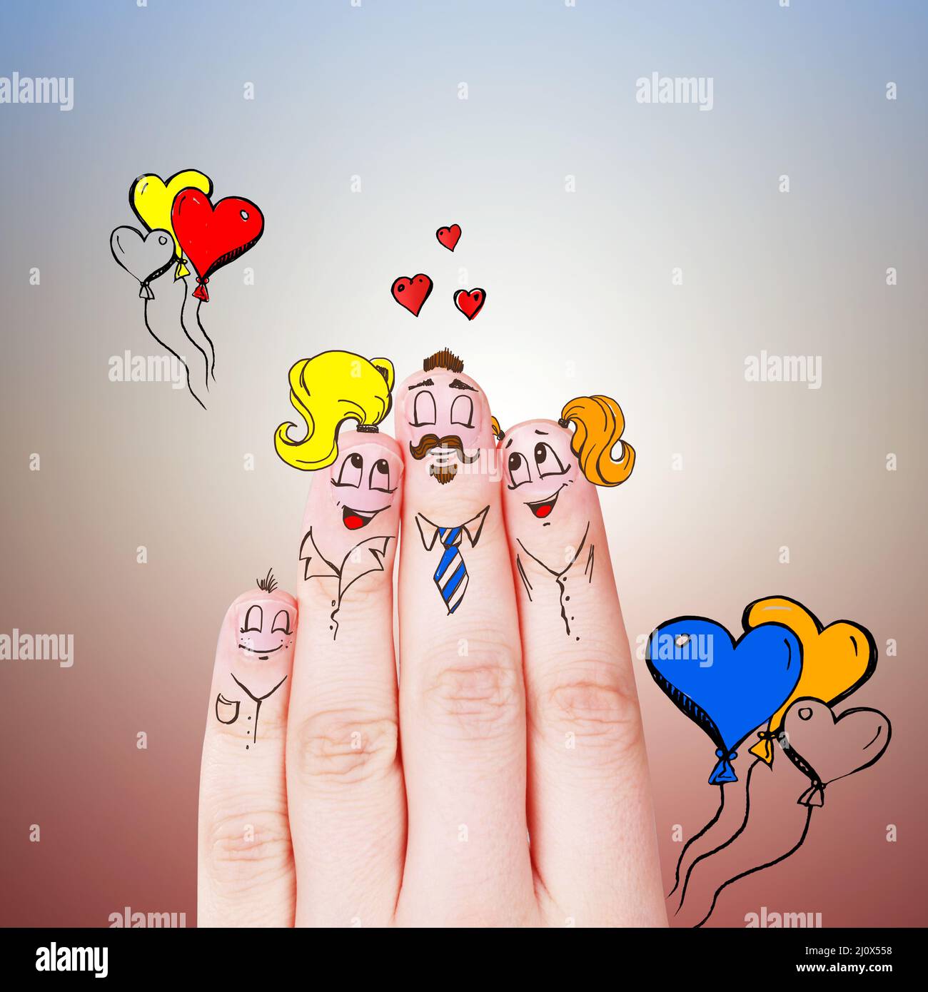 Finger puppets of loving parents with young child hugging and having ...
