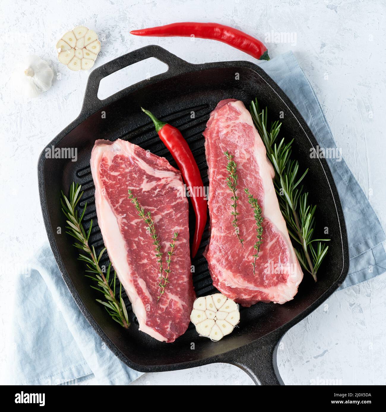Two fresh raw big whole pieces of meat, beef fillet, marble striploin ...