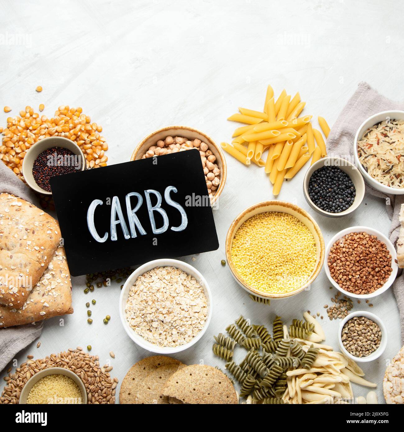 Best sources of carbs on light gray background. Healthy food concept ...