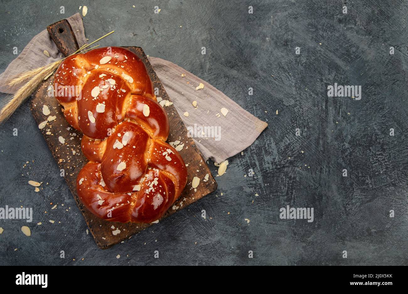 Easter sweet bread, tsoureki cozonac on dark background. Easter time ...