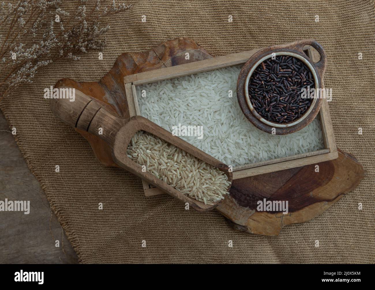 Various types of rice : Brown rice, Jasmine rice, Riceberry on old ...