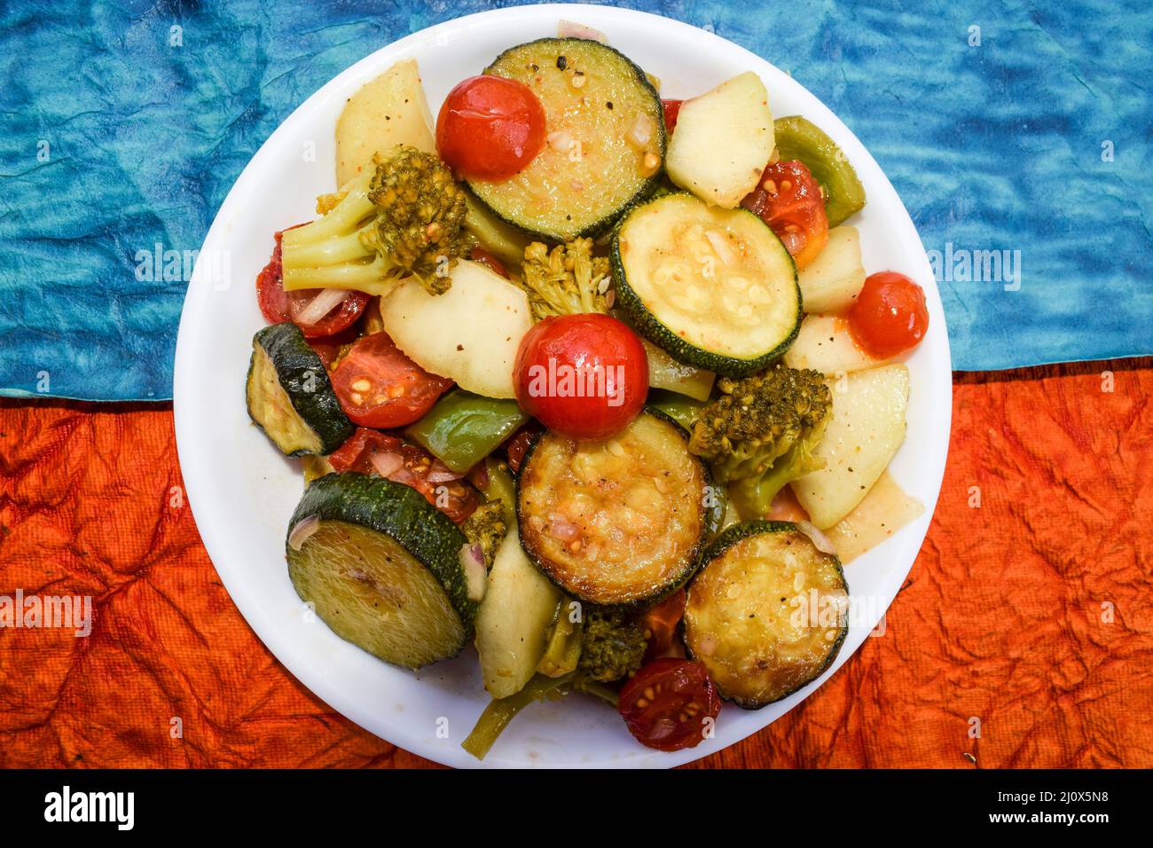 Fresh homemade salad made with red cherry tomato, broccoli, peach ...