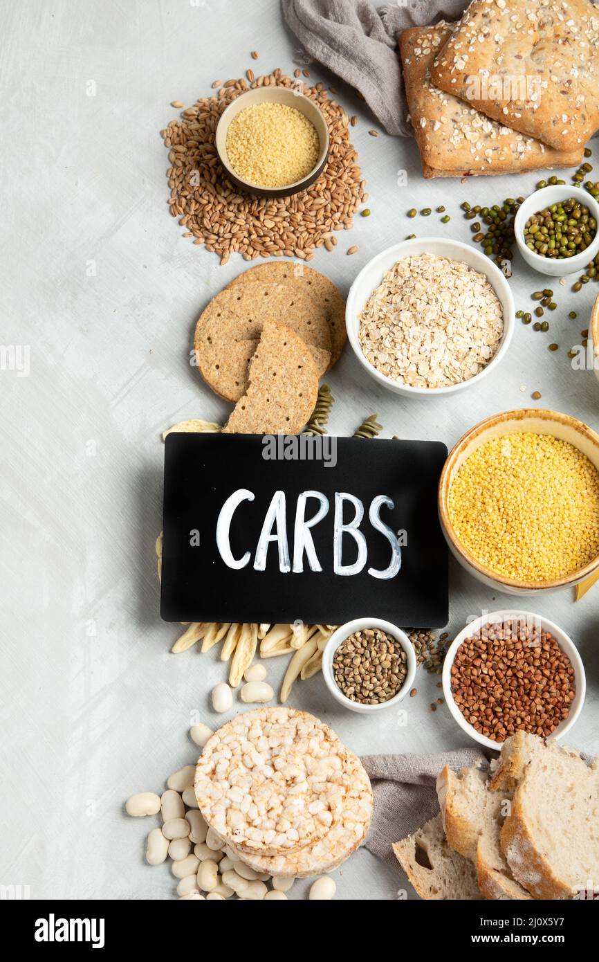 Best sources of carbs on light gray background. Healthy food concept ...