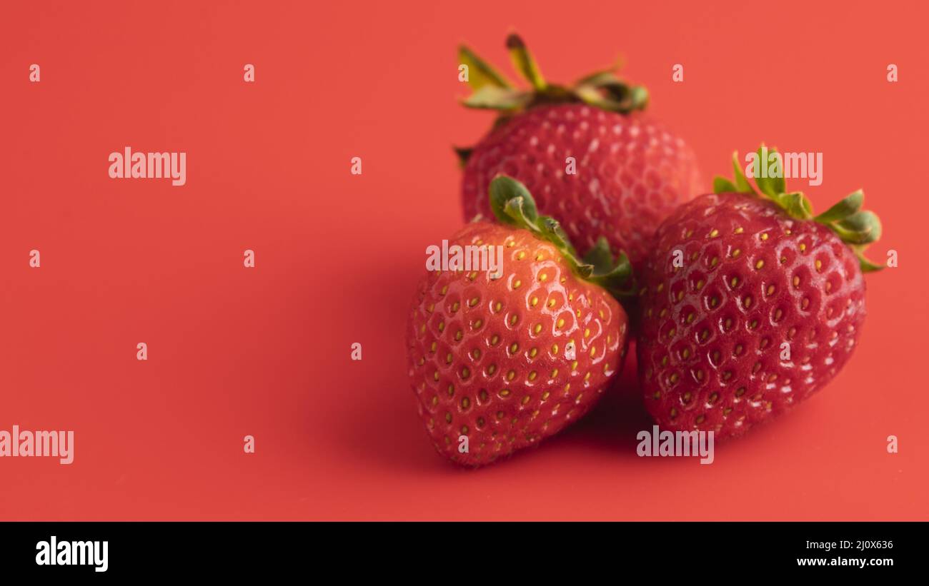 Front view three strawberries with copy space. High quality beautiful ...