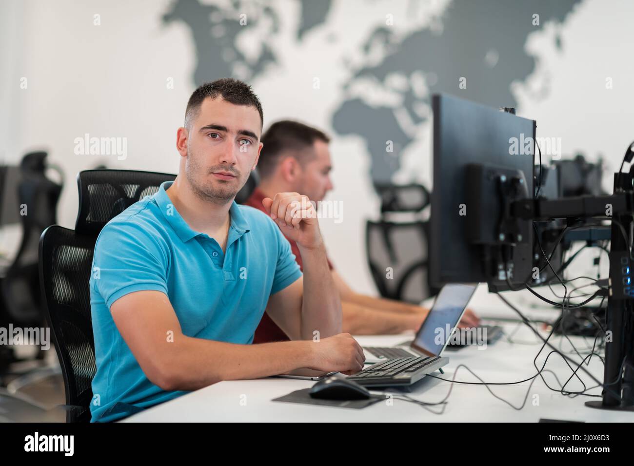 Group of Casual business man working on desktop computer in modern open ...
