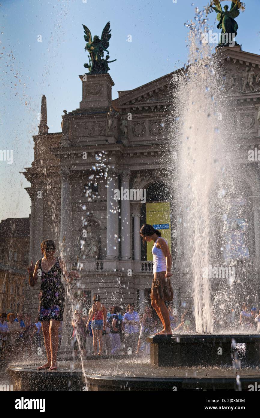 People playing in the fountain, L'viv, Ukraine Stock Photo - Alamy