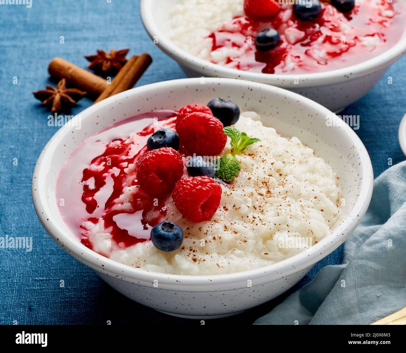 Rice pudding. French milk rice dessert with raspberries, blueberries ...