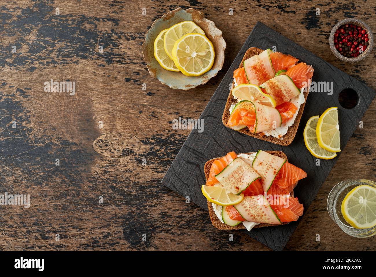 Smorrebrod - traditional Danish sandwiches. Black rye bread with salmon ...
