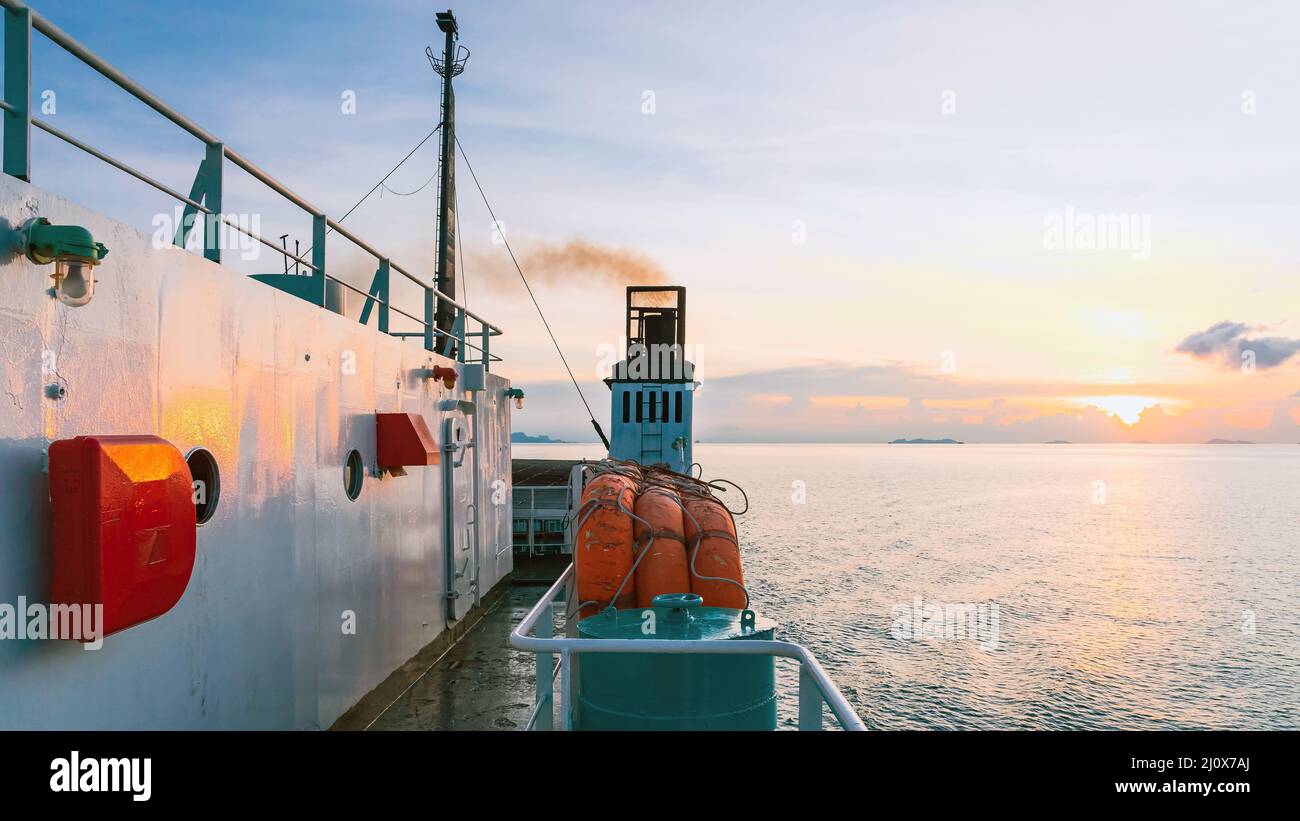 Orange inflatable lifeboats on ferry deck for emergencies and maritime ...