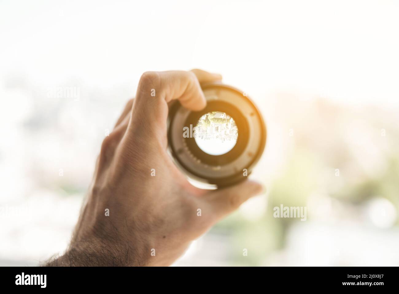 Hand holding lens hi-res stock photography and images - Alamy