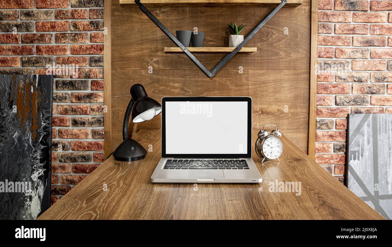 Front view laptop office workspace with lamp Stock Photo - Alamy