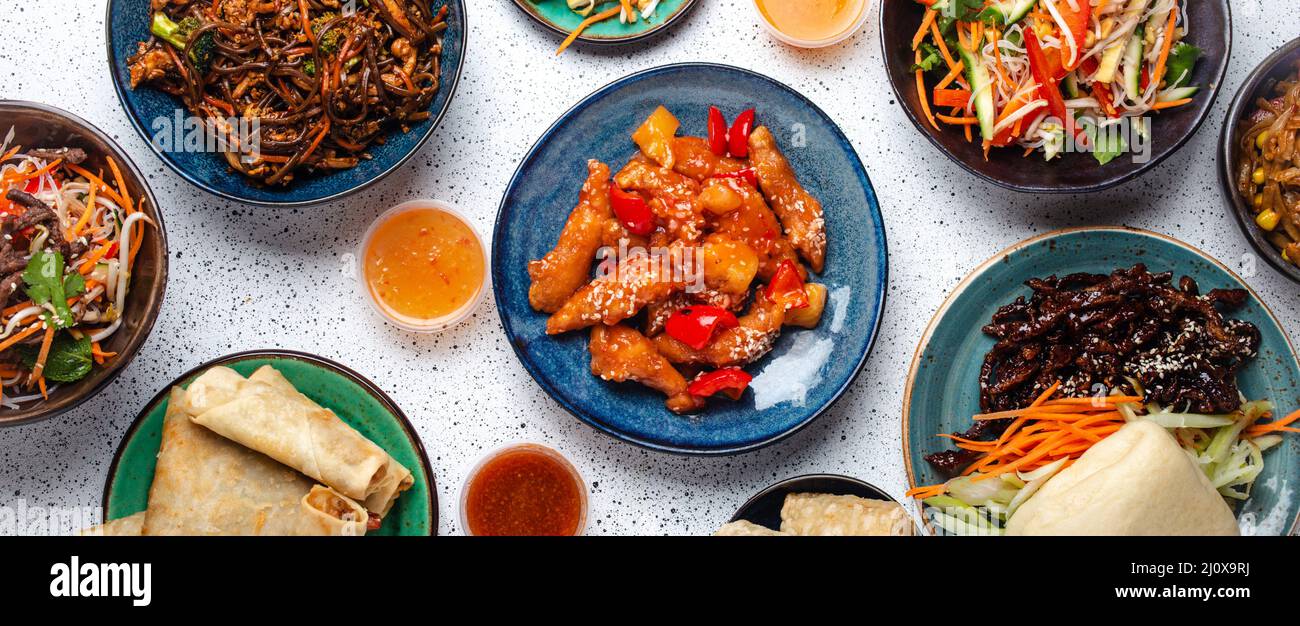 Set of Chinese dishes on white table Stock Photo - Alamy