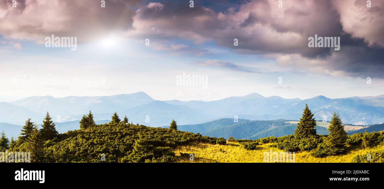 Beautiful view of rural alpine landscape. Overcast sky before storm ...