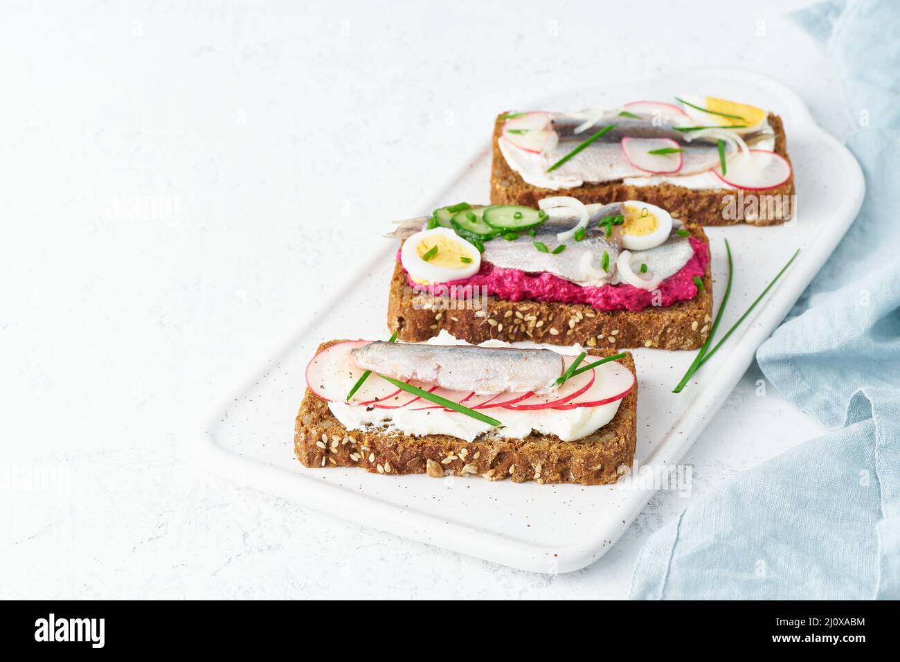 Savory smorrebrod, set of traditional Danish sandwiches. Black rye bread Stock Photo - Alamy