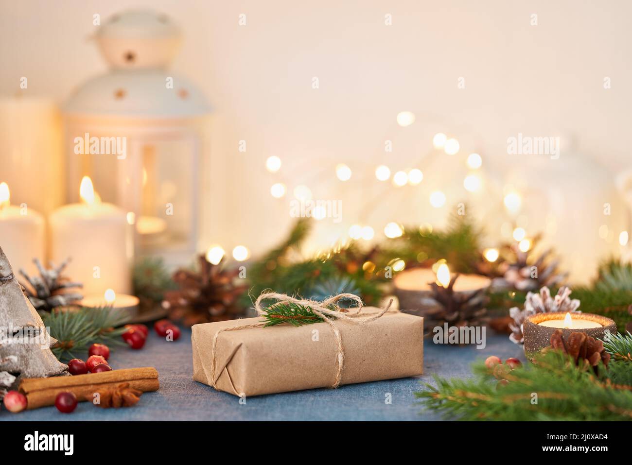 Christmas Background with gift box and decorations, candles and lights ...