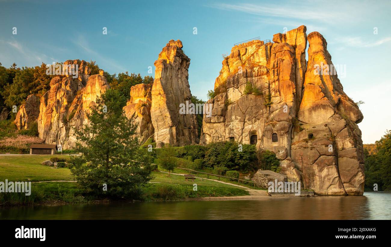 Externsteine rocks on the shore of Wiembecke in the Teutoburg Forest in ...