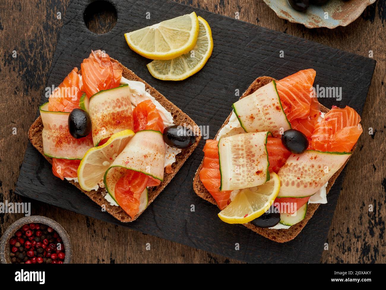 Smorrebrod - traditional Danish sandwiches. Black rye bread with salmon ...