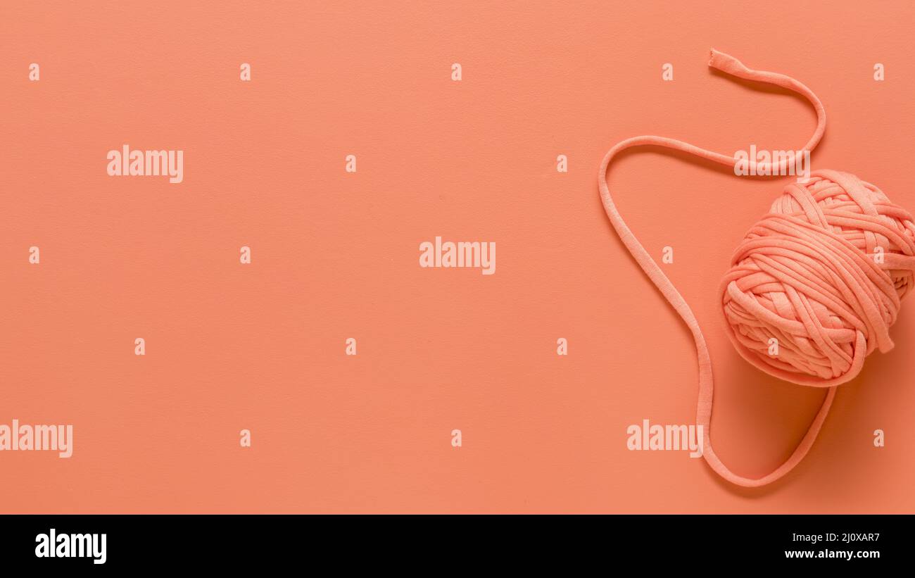 Pink composition with thread Stock Photo - Alamy