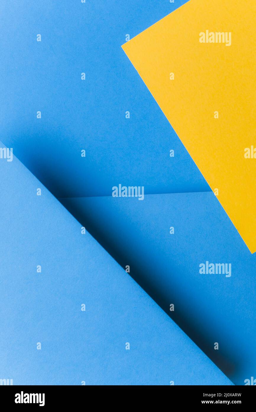 Color two tone blue yellow paper background Stock Photo - Alamy