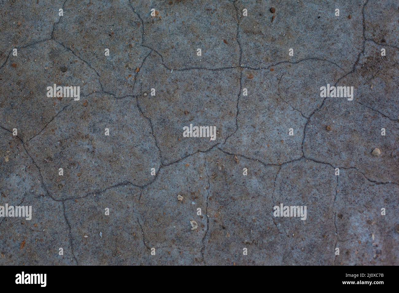 Dark gray background with cracks and hollows Stock Photo - Alamy