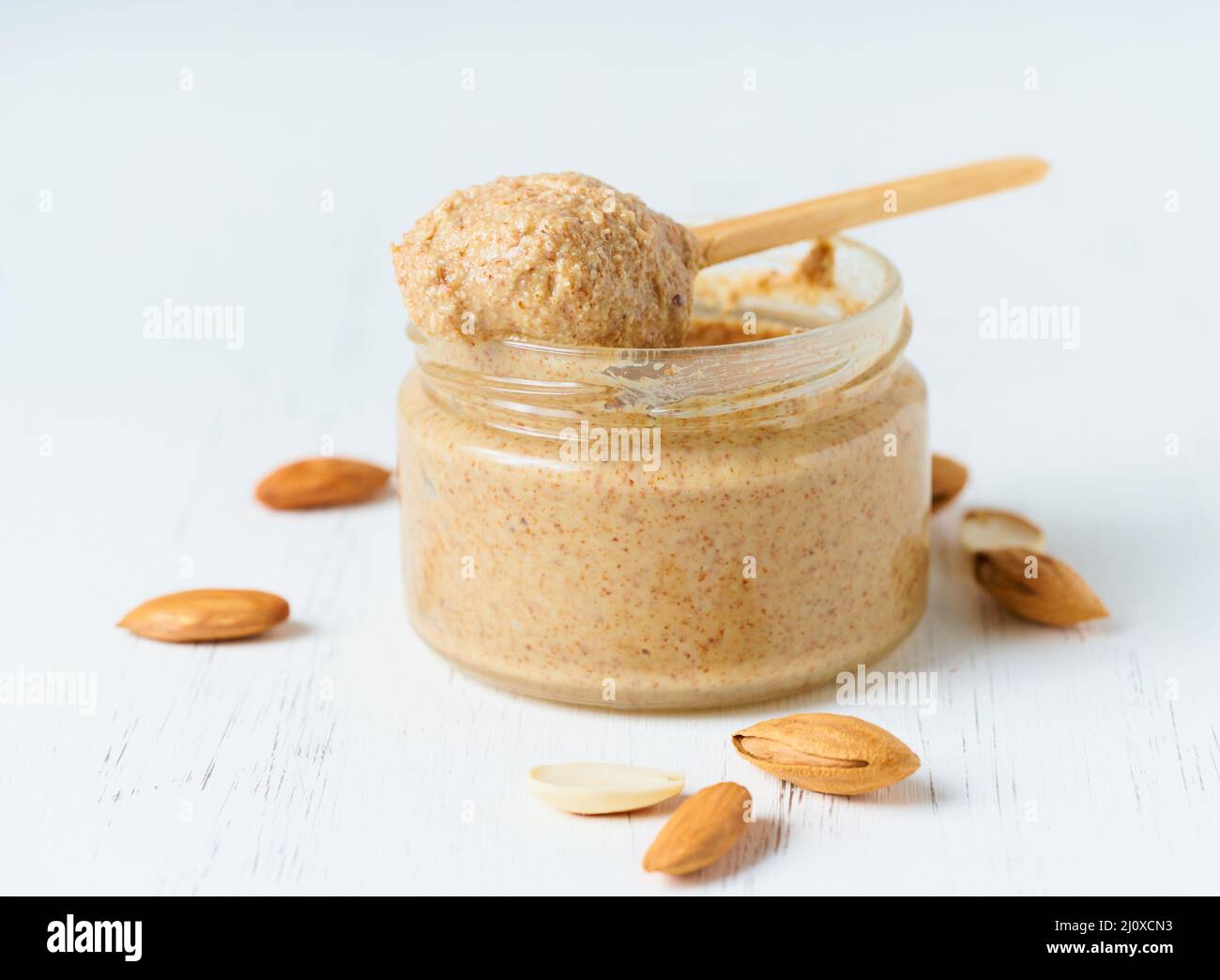Almond butter, raw food paste made from grinding almonds into nut ...